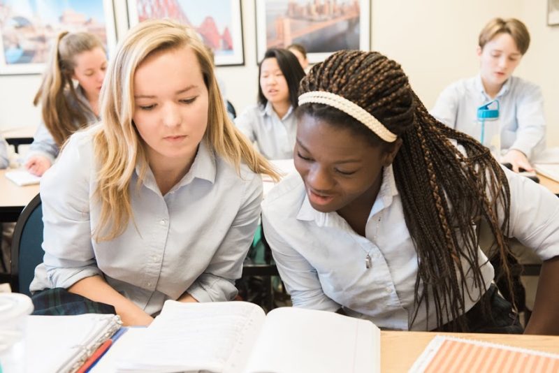 two students collaborating - Trinity Schools